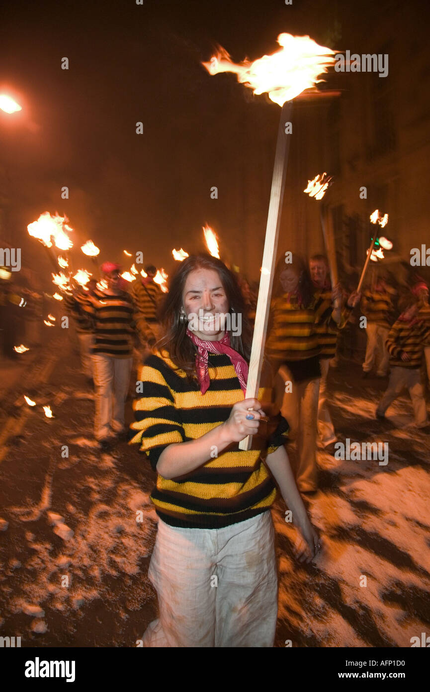 Female member of Commercial Square Bonfire Society carries a burning ...