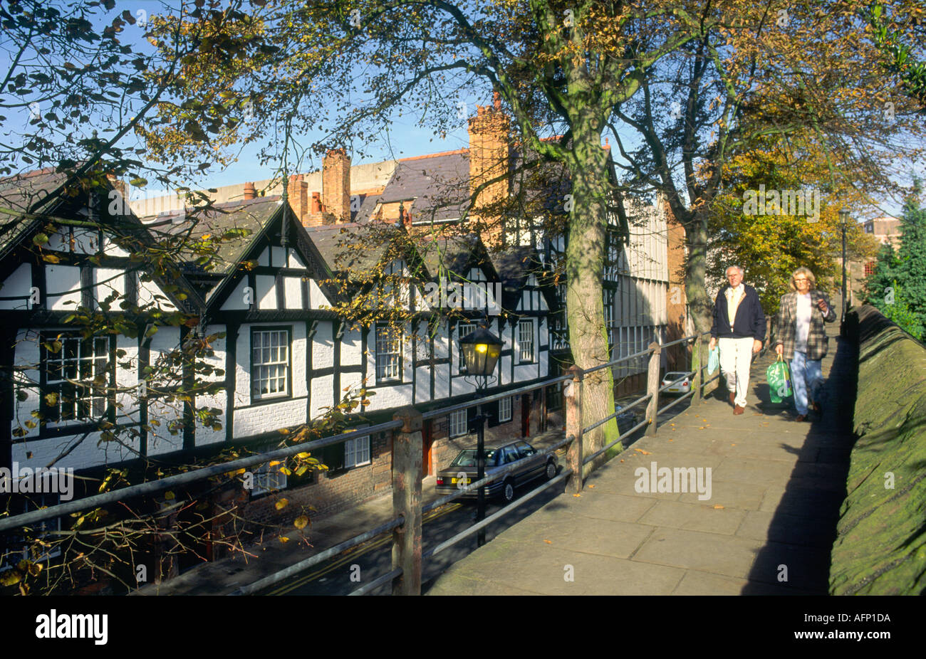 Chester, Cheshire, England. Middle age couple walking on the Roman city ...