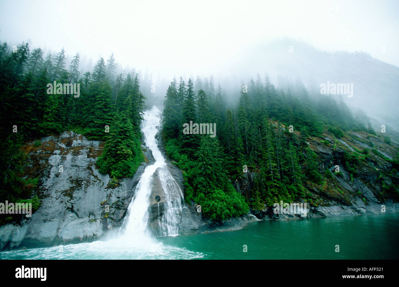 USA Southeast Alaska Tracie Arm Hole in the wall waterfall cascading ...