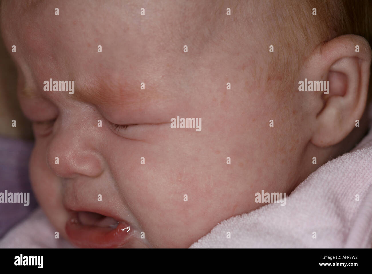Baby with red hair crying Looking away from camera Stock Photo - Alamy