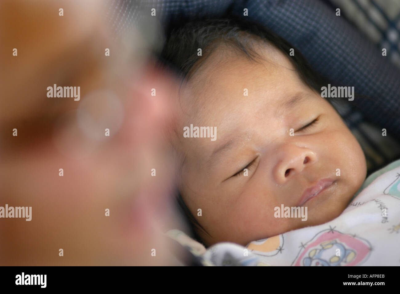 Asian heritage baby boy with his father Stock Photo - Alamy