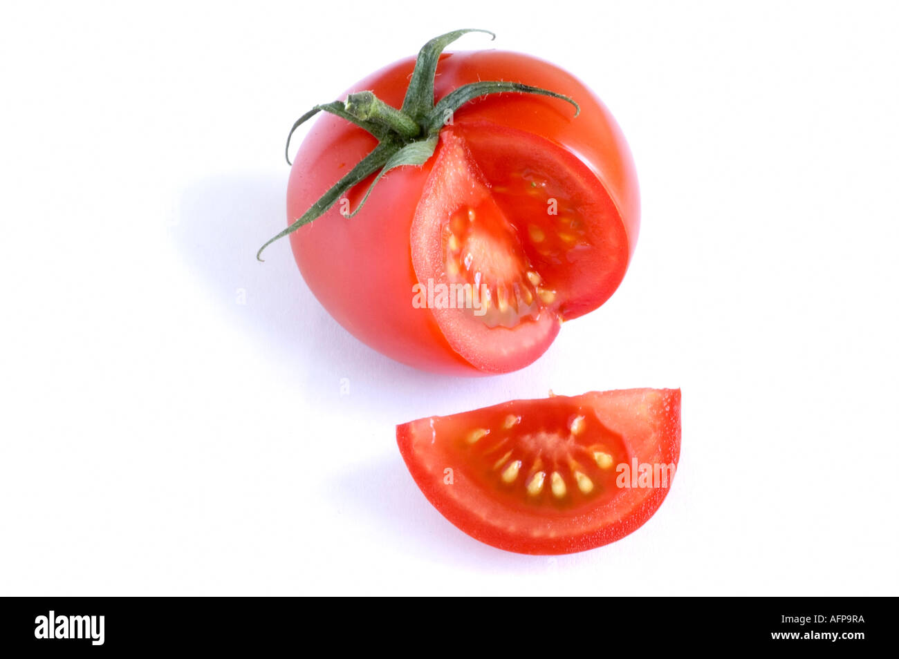 Vine ripened tomato against a white background Stock Photo - Alamy