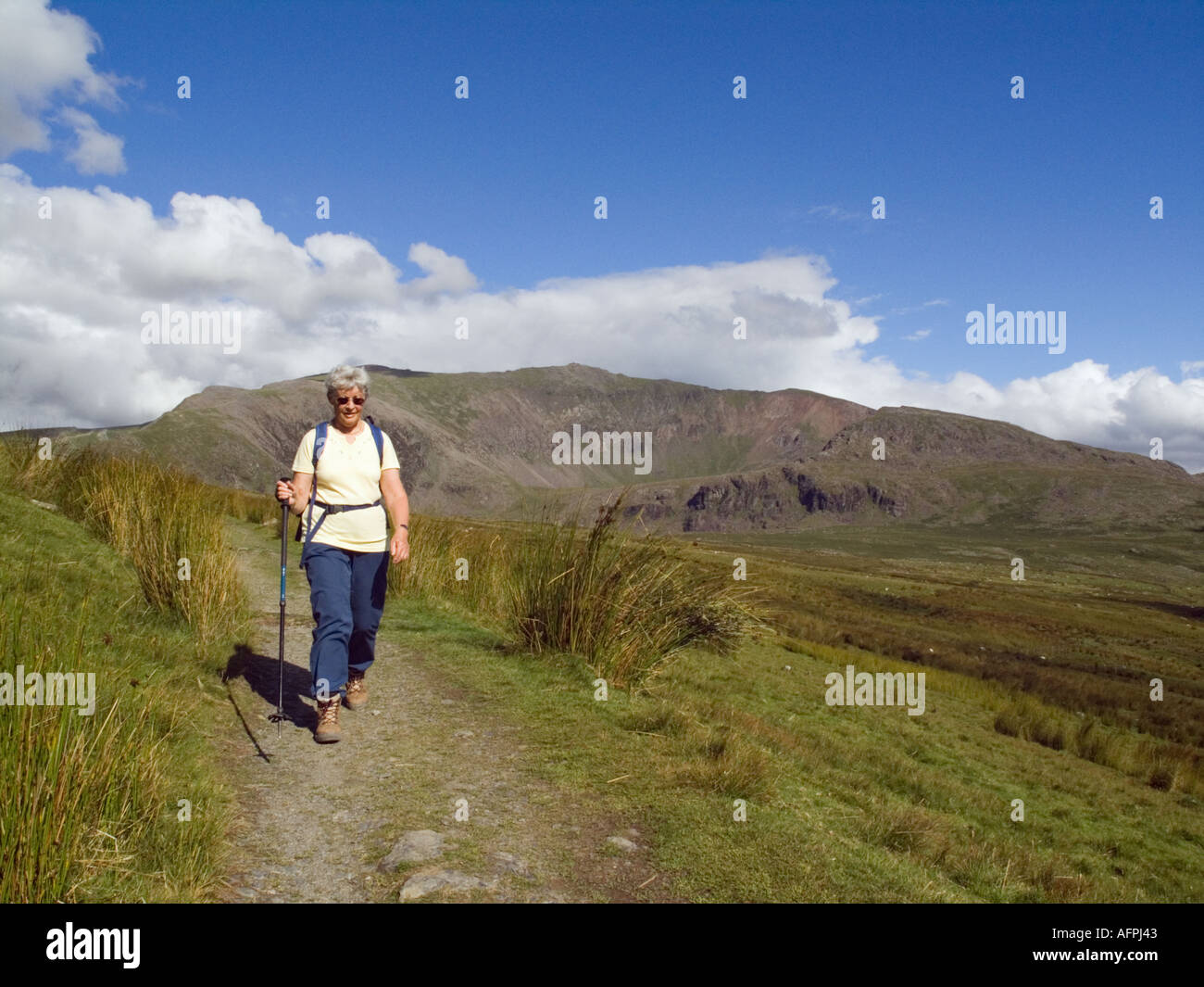 SNOWDON RANGER FOOTPATH with female walker descending in Snowdonia ...