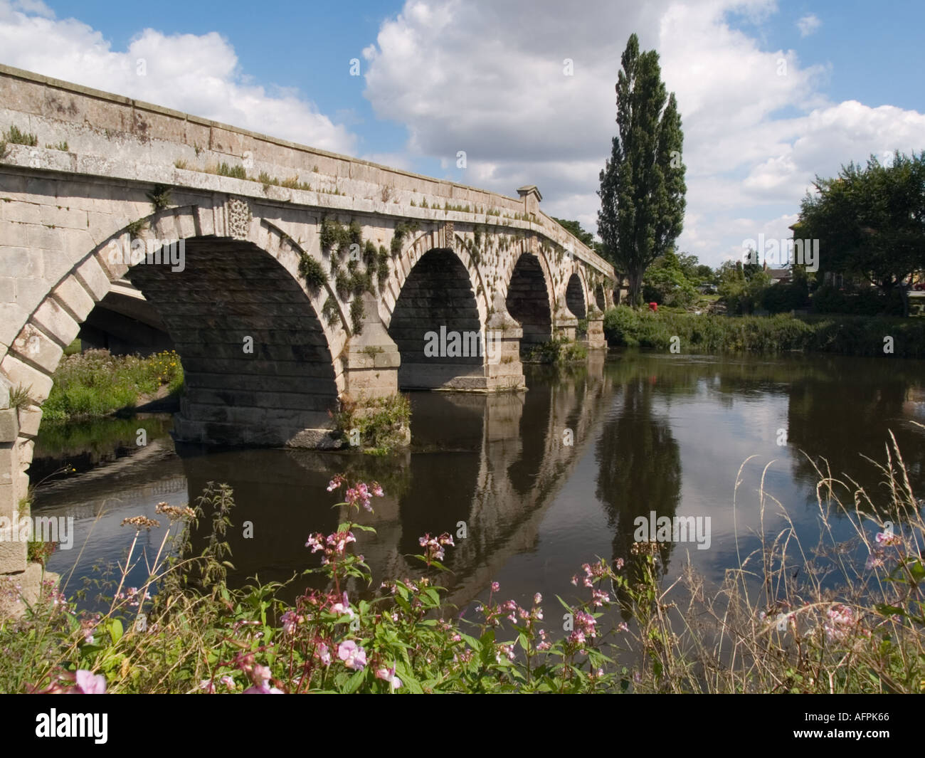 ATCHAM OLD STONE BRIDGE over River Severn in summer Shropshire England ...