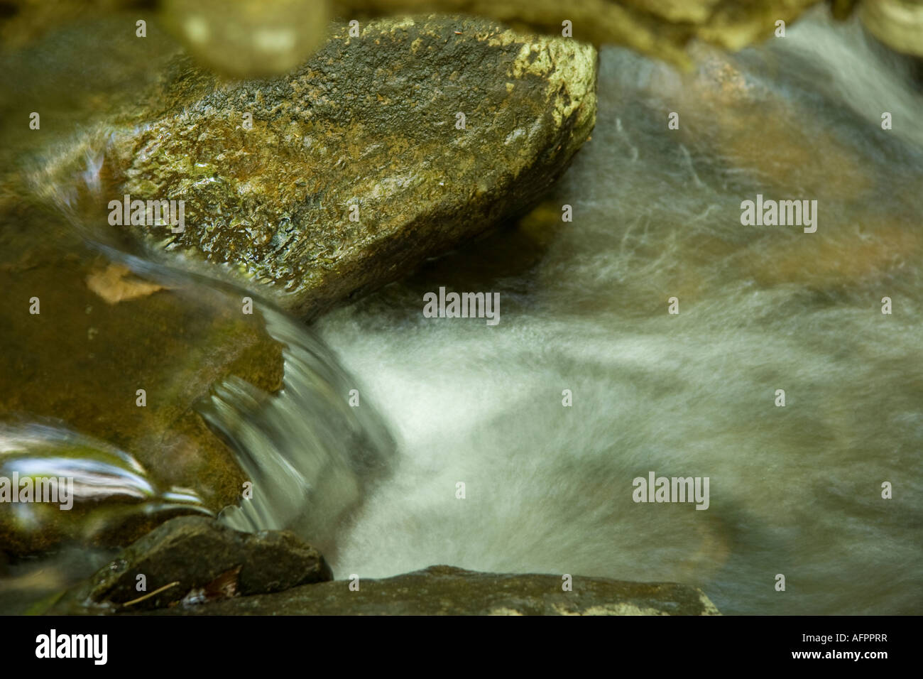 Running stream over rocks Stock Photo - Alamy