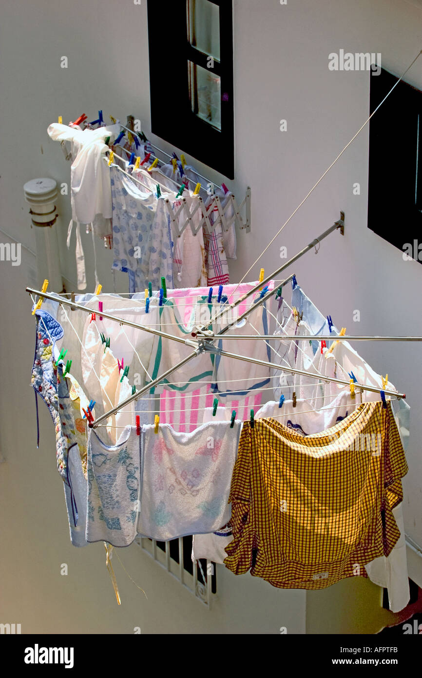 A building in spain with washing drying clothes Stock Photo - Alamy