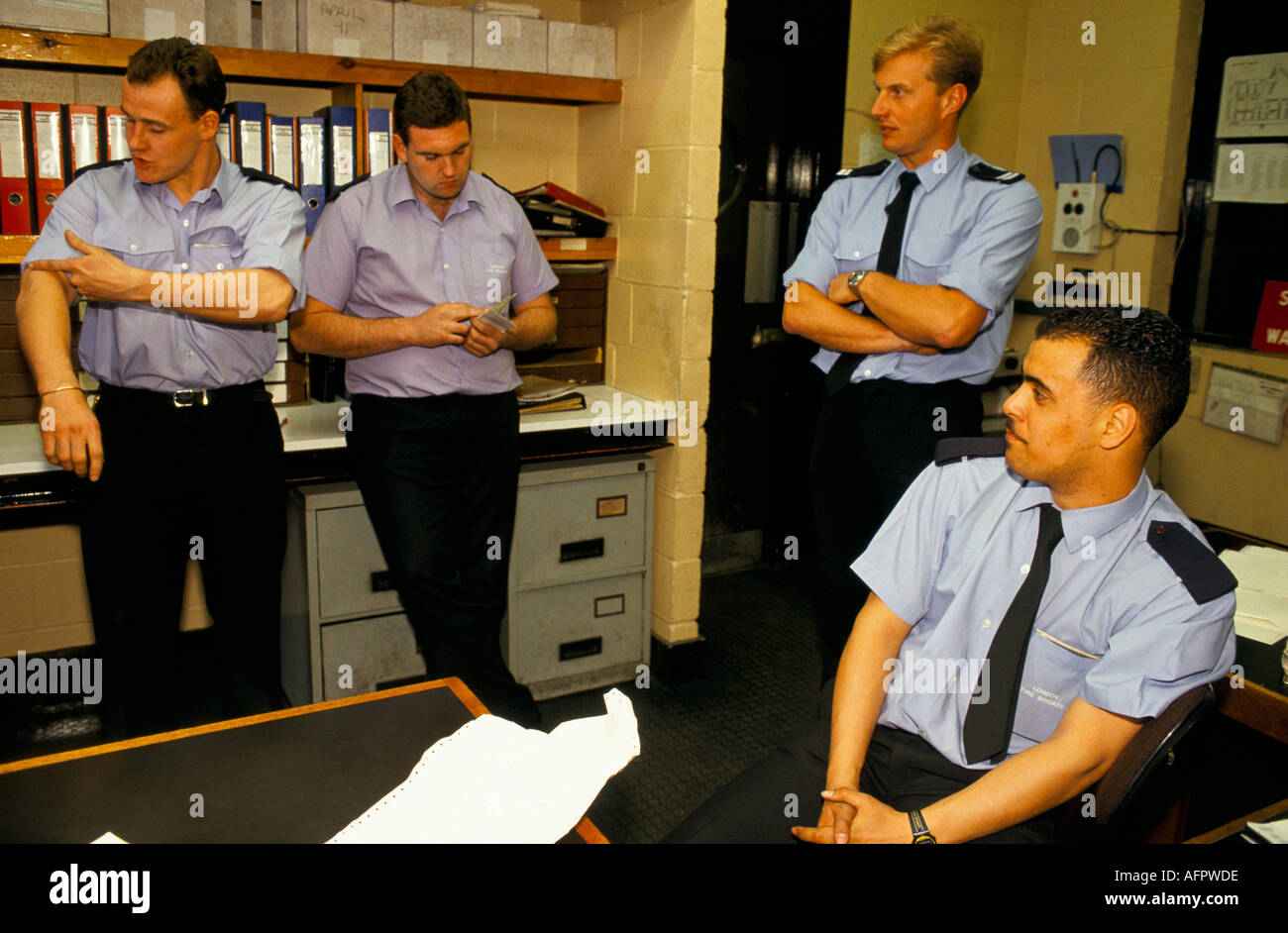 Firefighters, Jason Wilder, (sitting) a Black British fireman ...