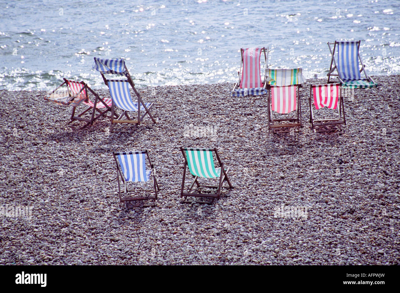 Beach Chairs Deck Chairs on Stony Beach in Summer Stock Photo - Alamy