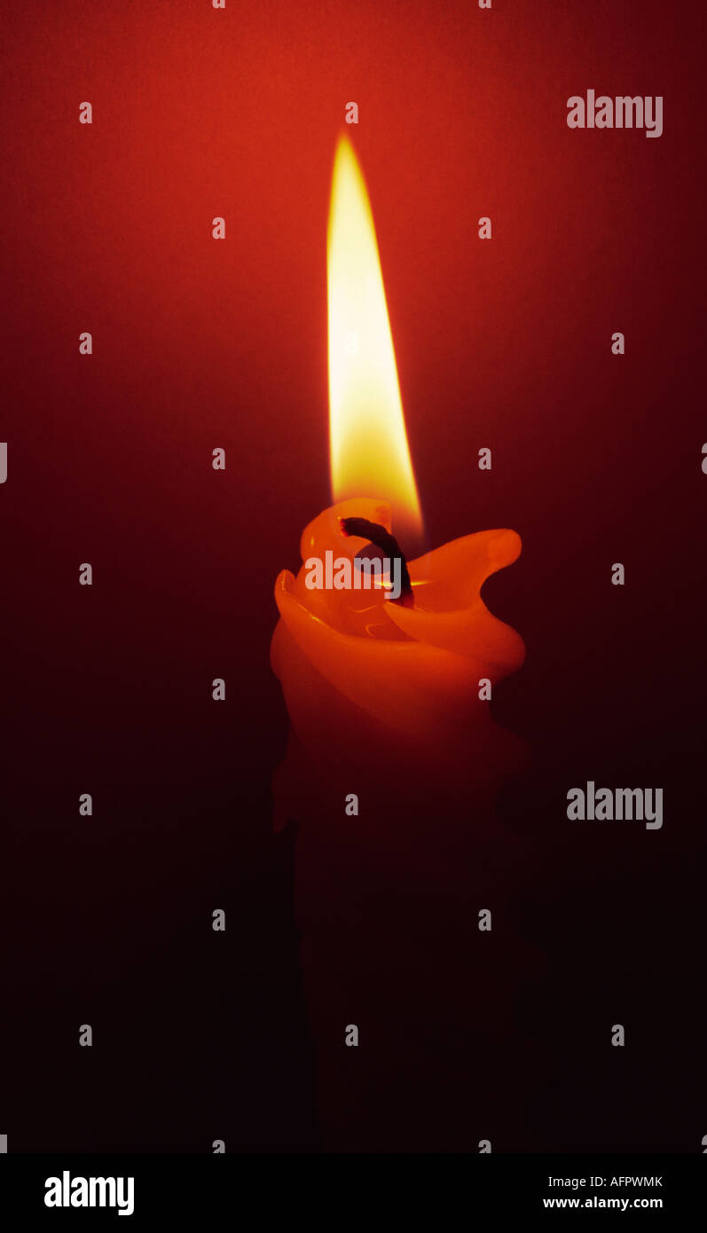 Close up of Top of Lit Candle with Halo against Dark Background Stock ...