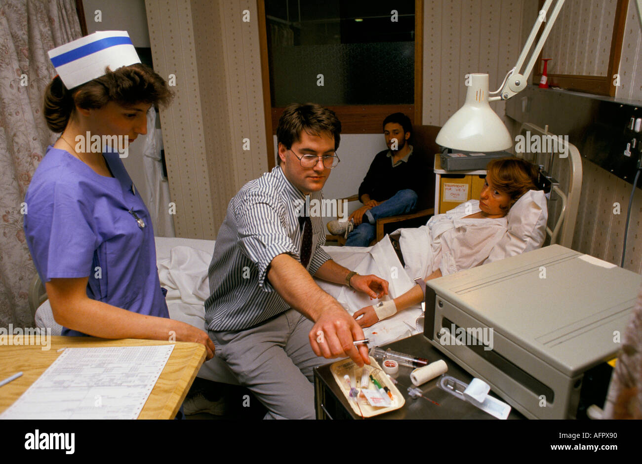 NHS 1980s doctor nurse attend to pregnant woman husband Royal United ...