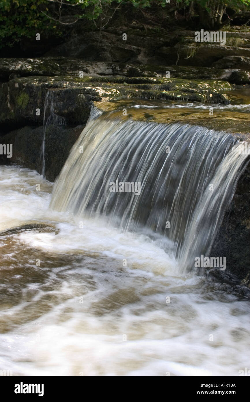 Freshwater Source River water falling over natural stone slab, creating ...