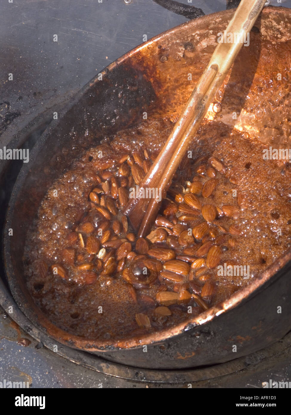 Almond nuts cooking in street vendor stall village of Mijas Costa del ...