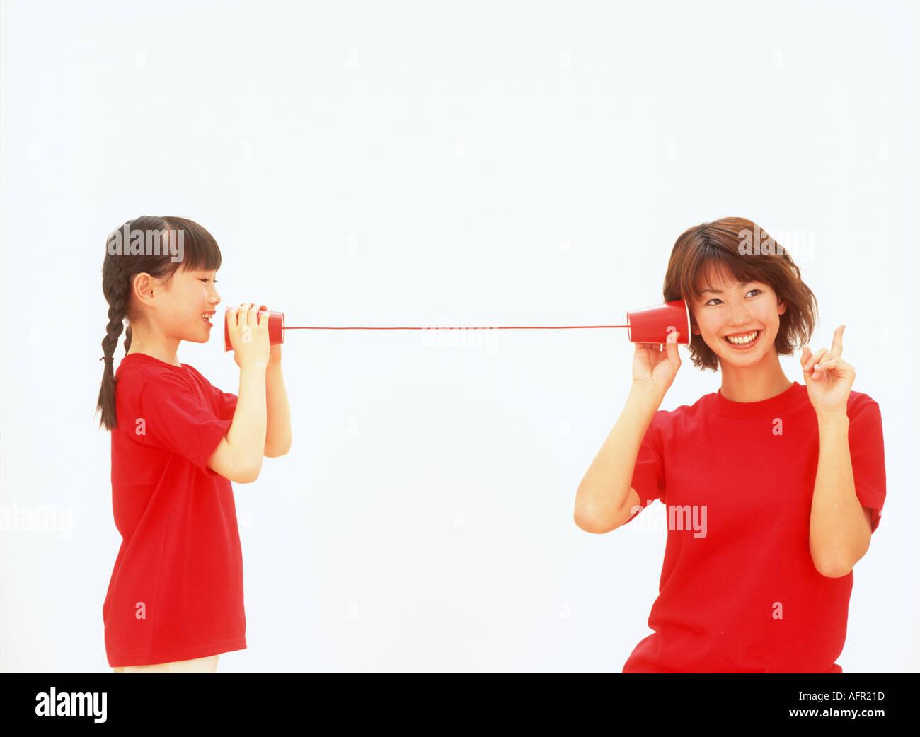 Mother Child on String Telephone Stock Photo - Alamy