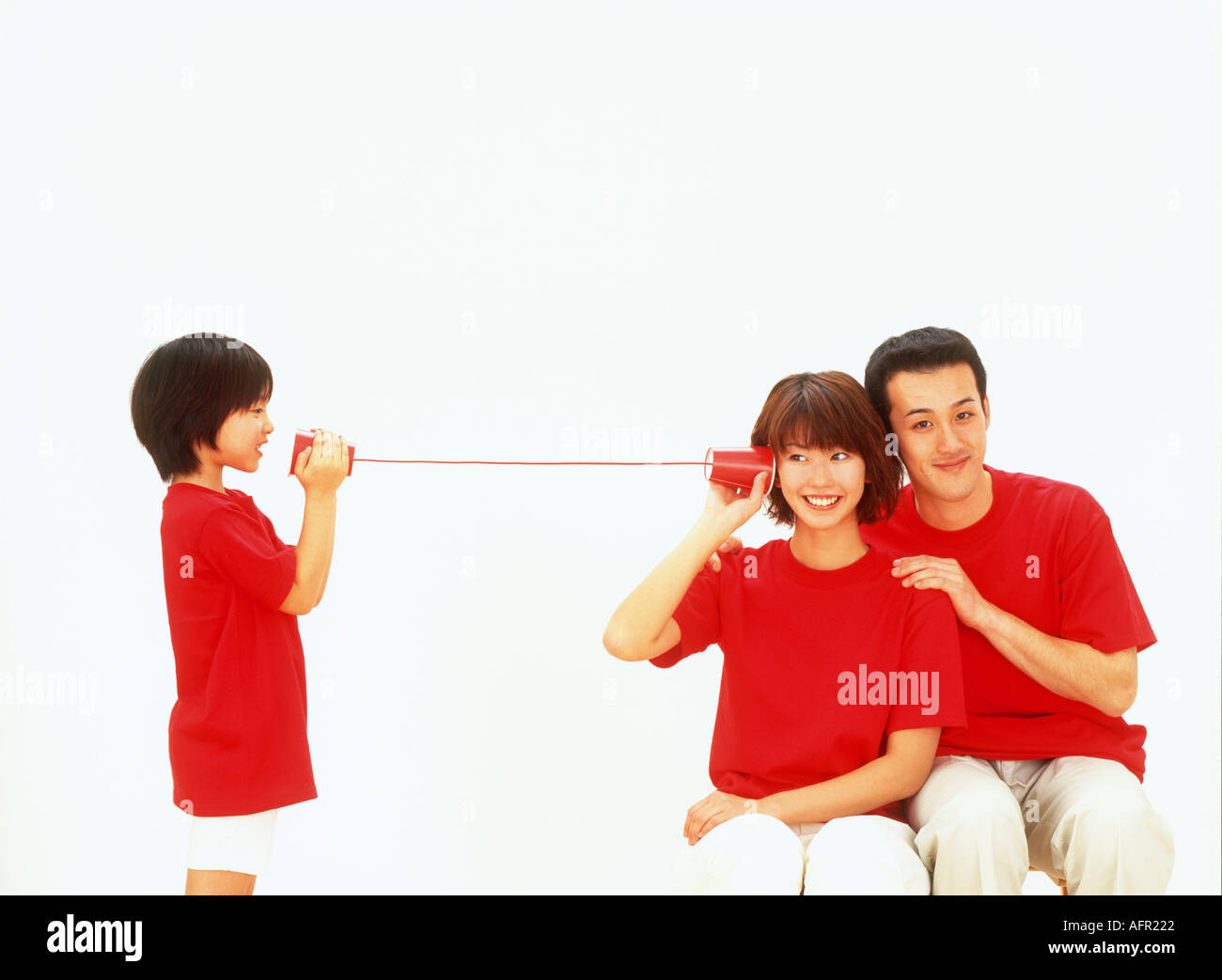 Family on String Telephone Stock Photo - Alamy
