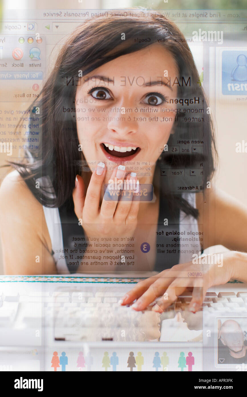 Girl looking at online dating website Stock Photo - Alamy