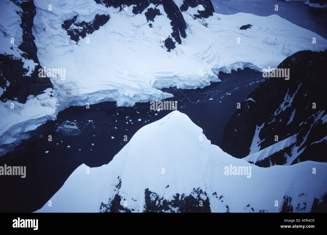 From the air above peak on Booth Island above the Lemaire Channel ...