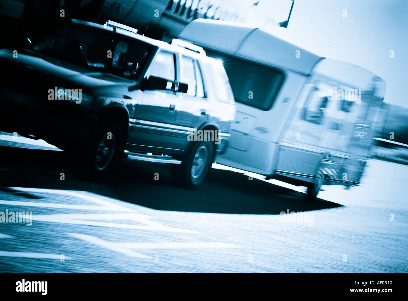 caravan being towed at speed by an suv on car motorway freeway stuck ...