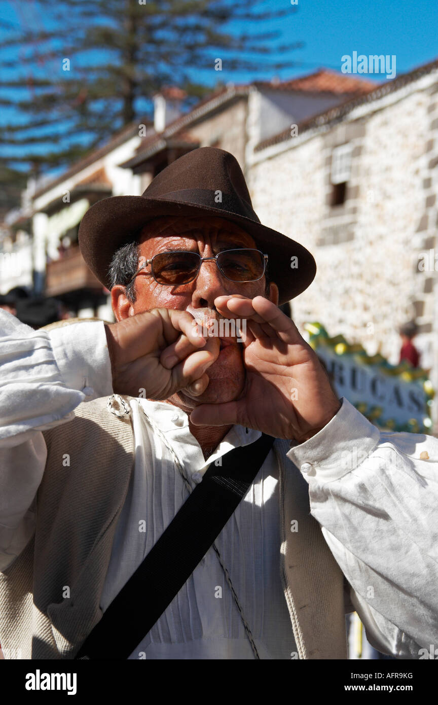 Man in traditional dress from La Gomera demonstrating "El Silbo", the ...