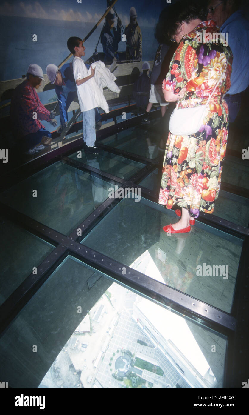 Take a nerve wracking step onto glass panels in the floor of the ...