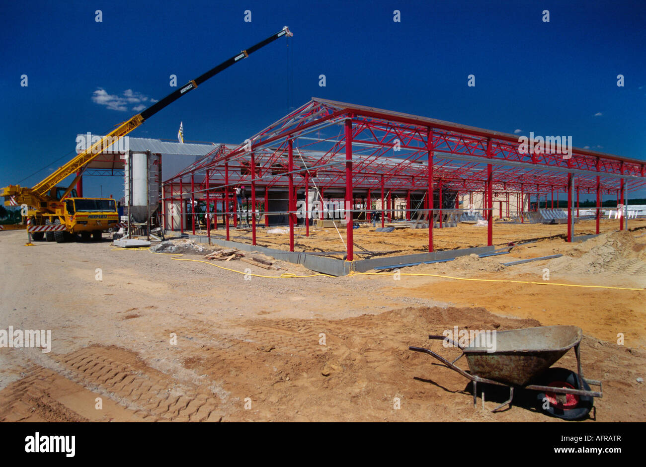 building site with red framework of warehouse being built Stock Photo ...