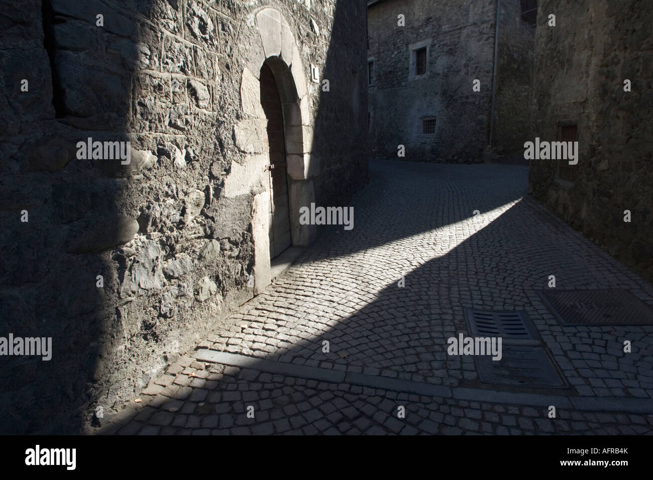 Cobbled street and stone building, Bormio, Italy Stock Photo - Alamy