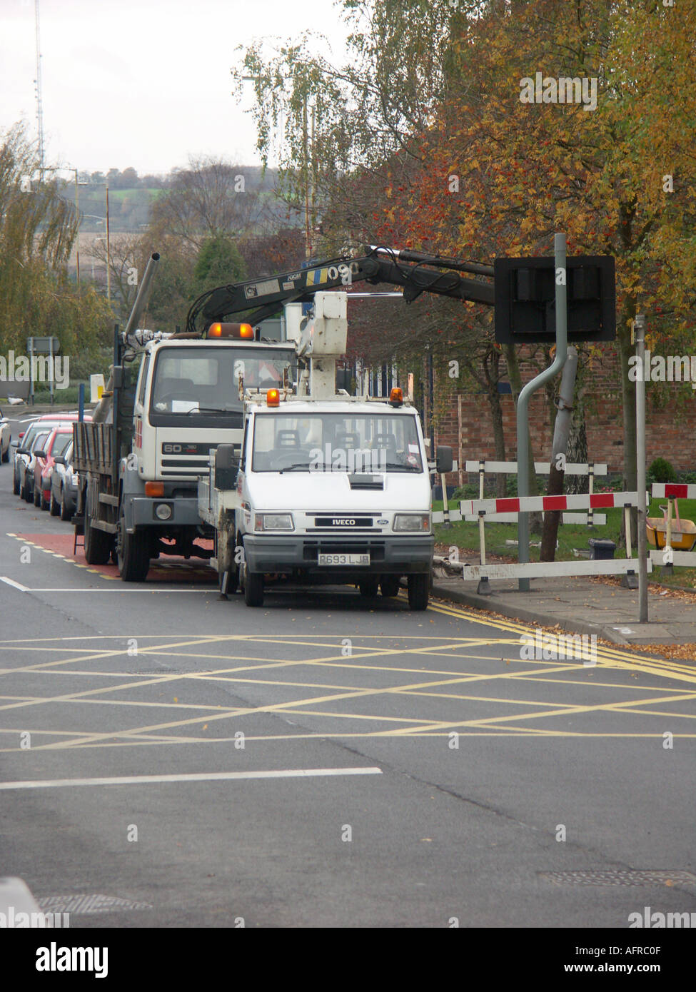 Removing old street signpost Stock Photo - Alamy