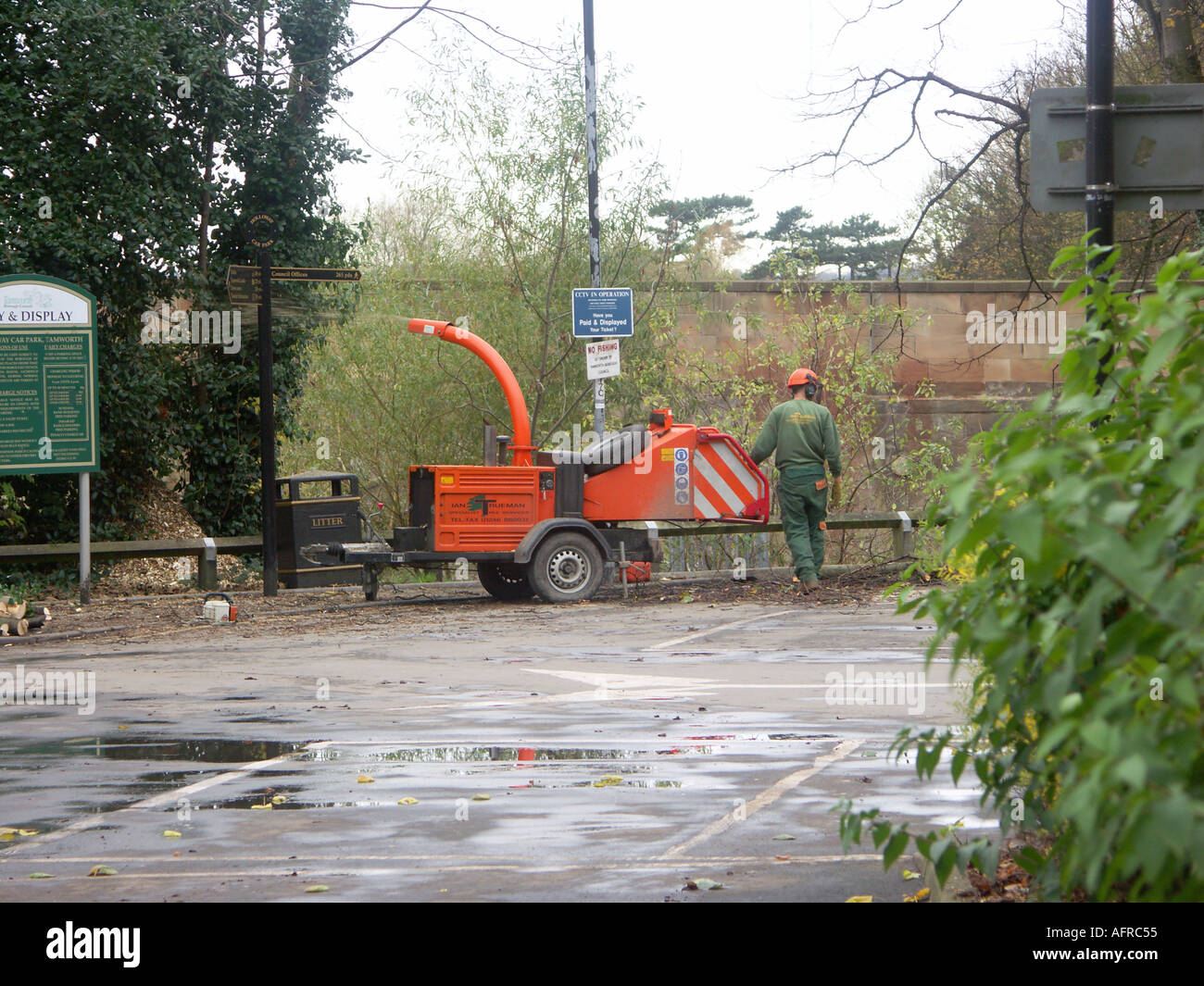 Wood tree branch chipper shredding hi-res stock photography and images ...