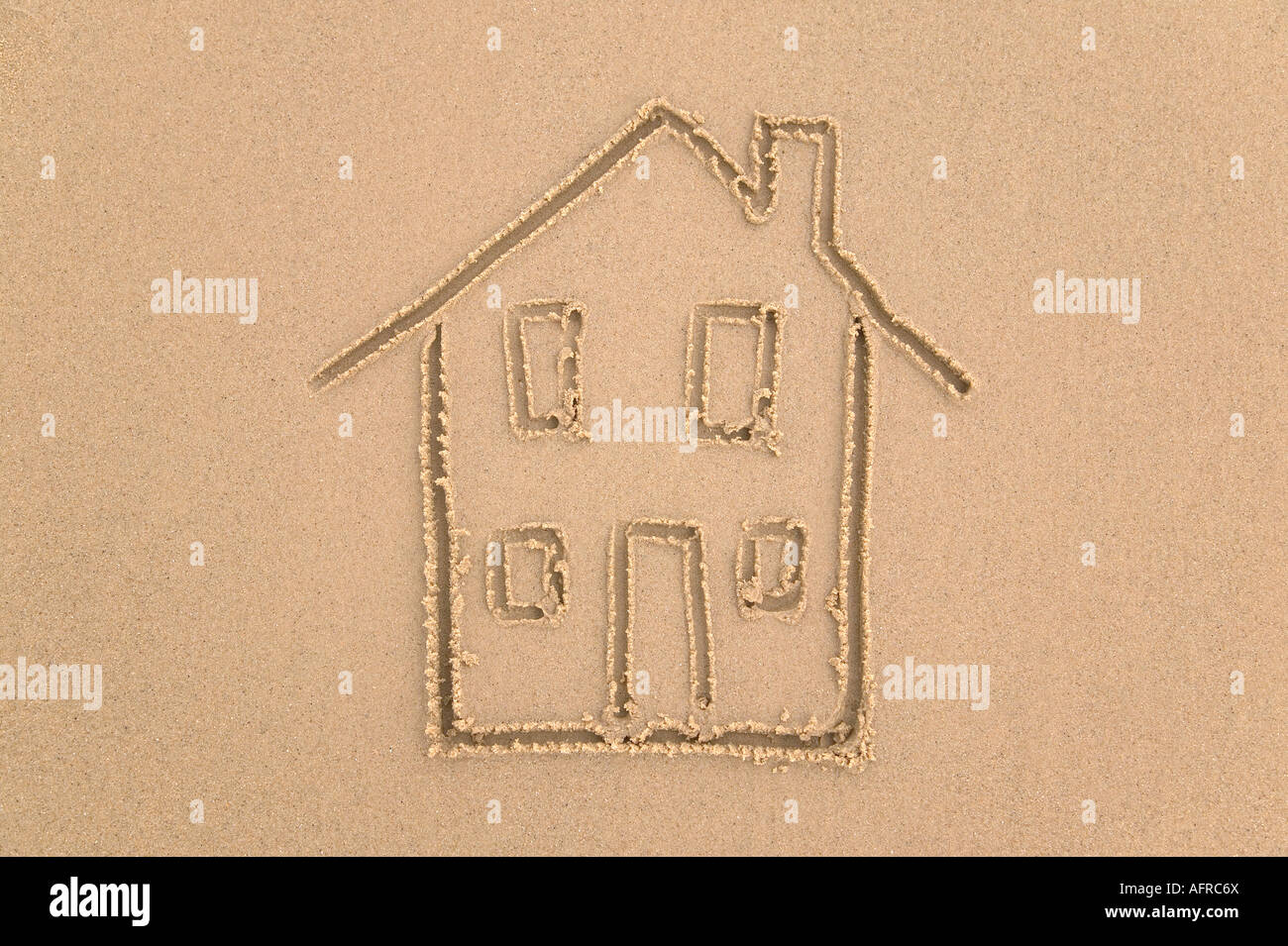 Sand drawing of a house Stock Photo - Alamy