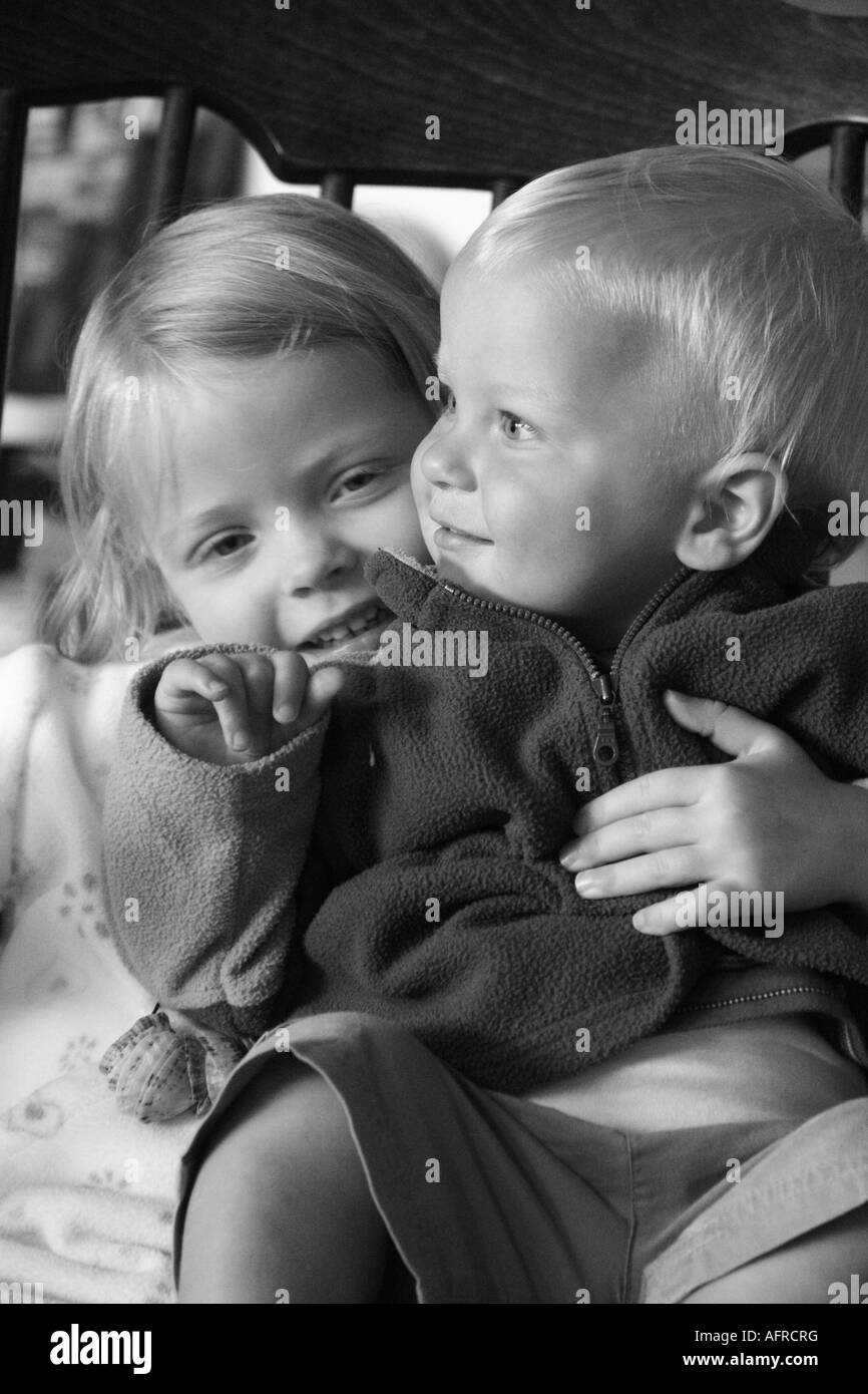 Little Girl Looking After Her Baby Brother Stock Photo - Alamy