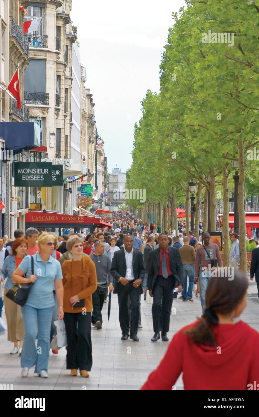 People walking on the pavement/sidewalk at Champs De Elysee Avenue ...