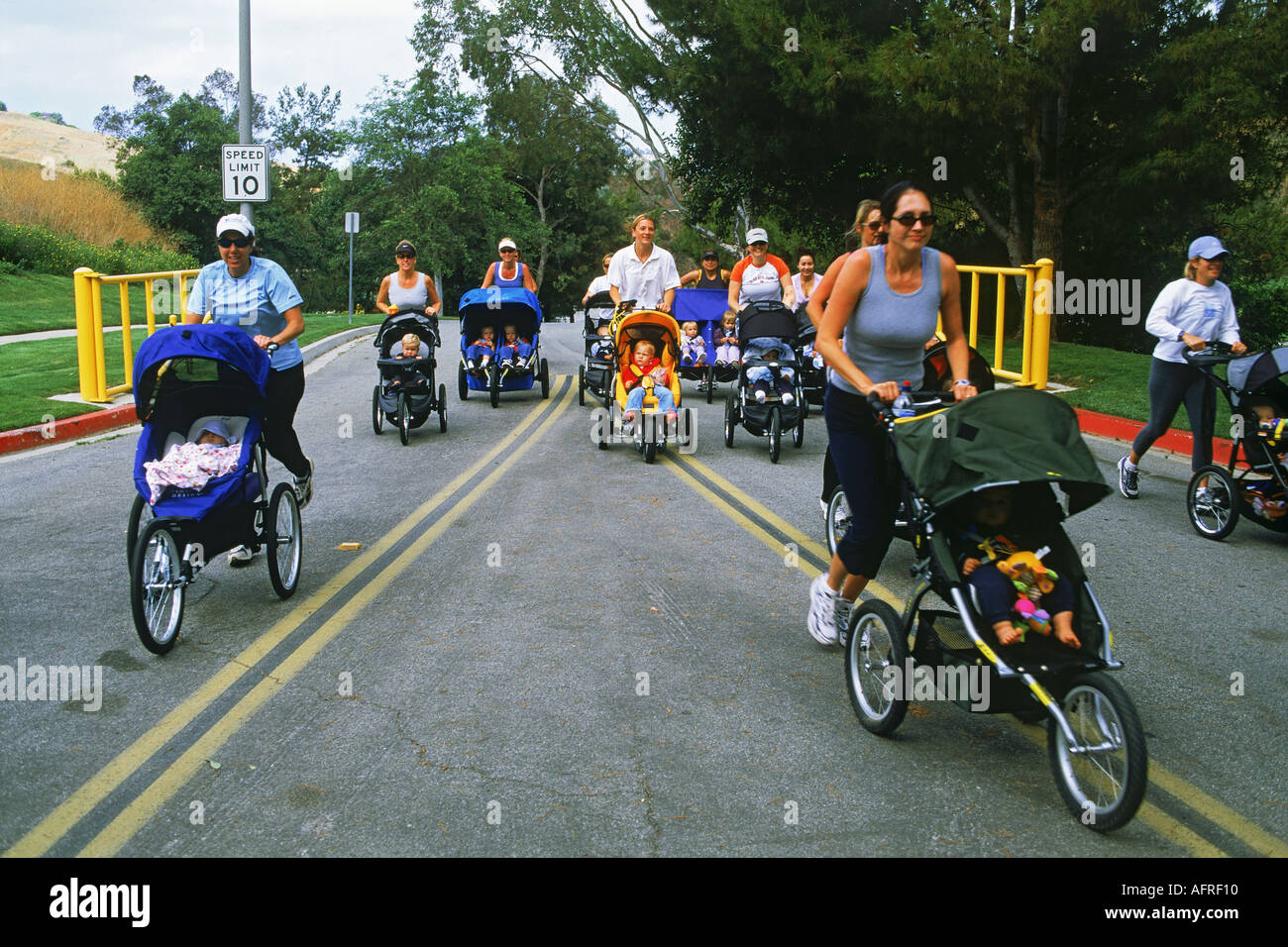 Mothers running with baby strollers in California park Stock Photo - Alamy