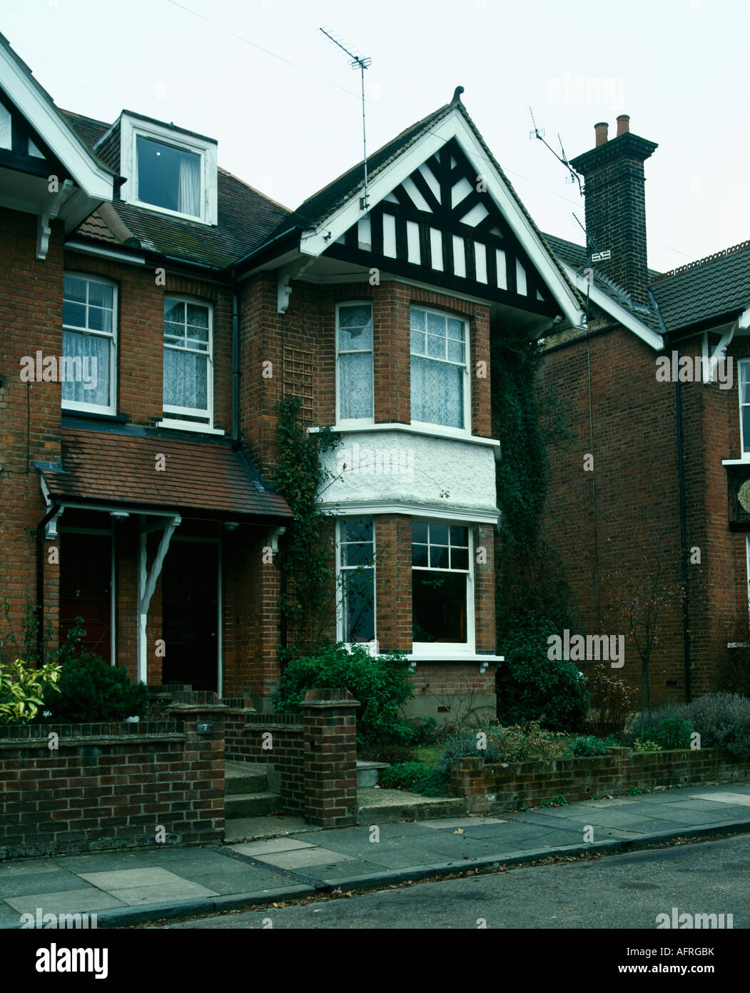Traditional semi detached Edwardian red brick house with white ...