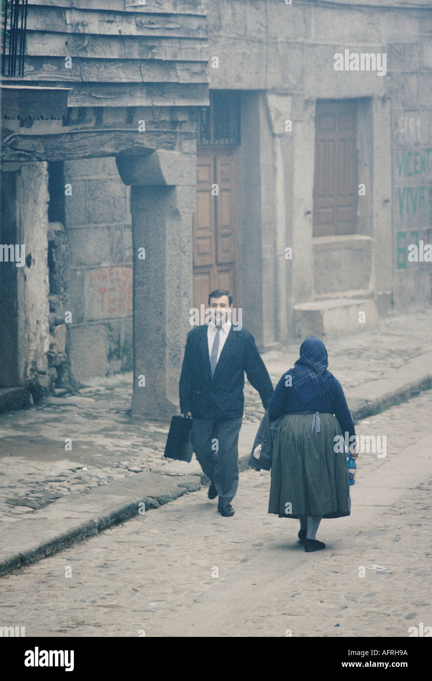 Spain poverty 1990s Europe. Man going to work old woman dressed in ...