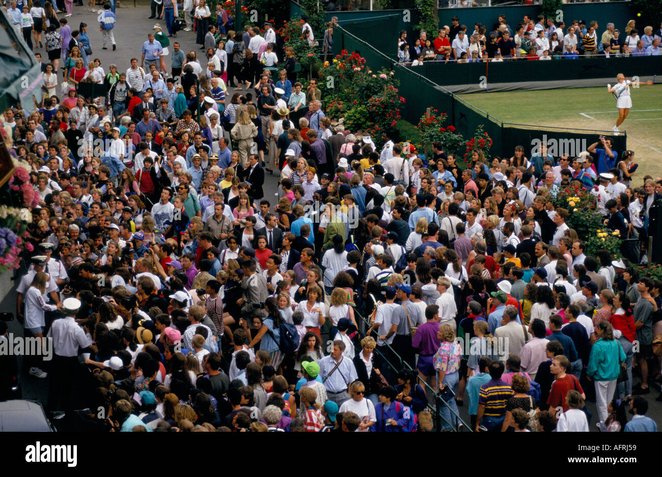 Steffi Graf 1990s (on left in white) signs autographs for crowds of ...
