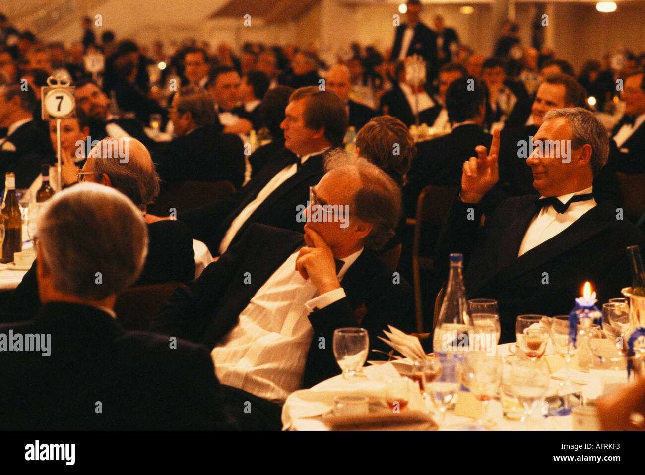 Audience charity auction. Black tie event formal dinner business people ...