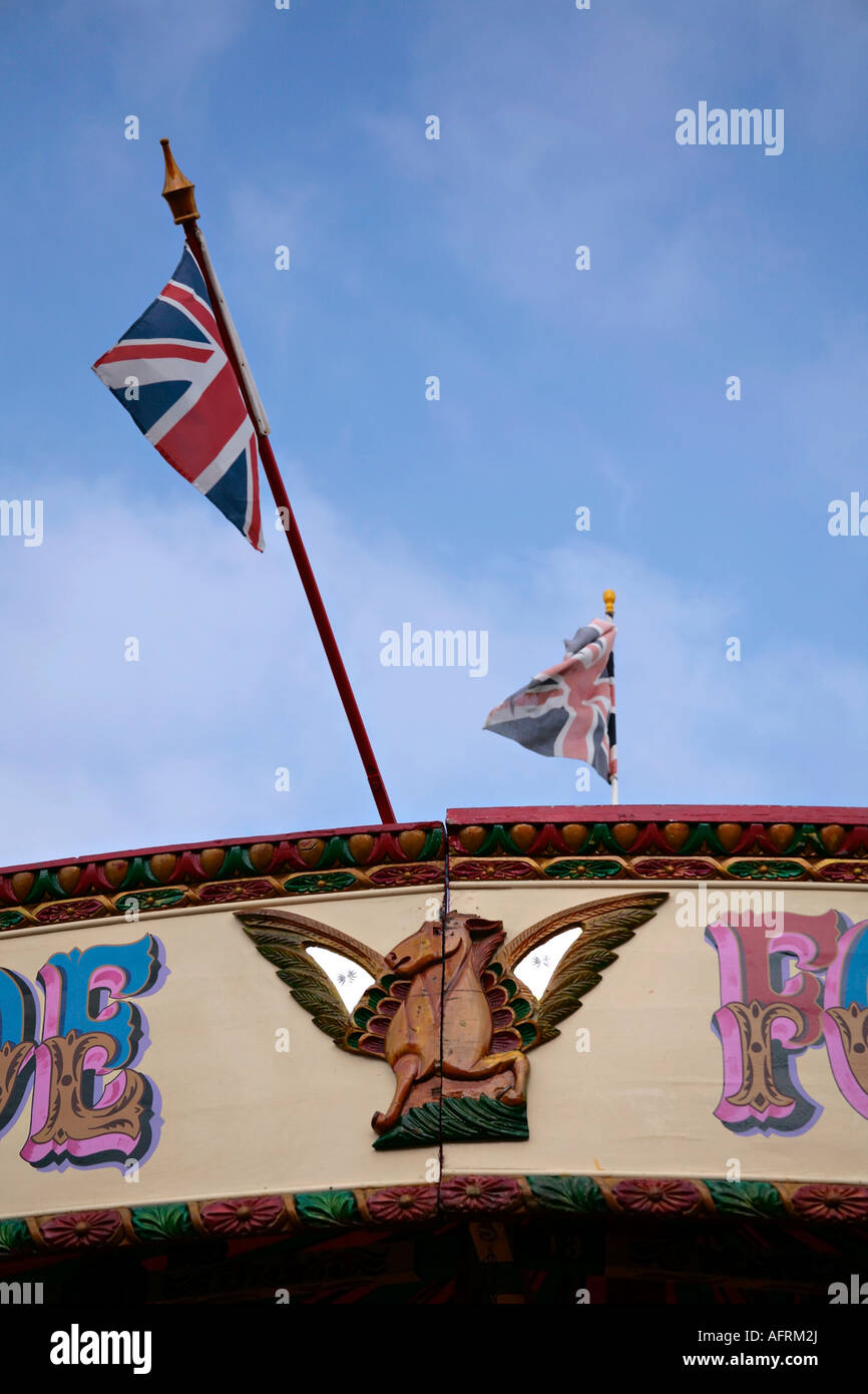 Union flag flying on top of carousel ride at English village funfair ...