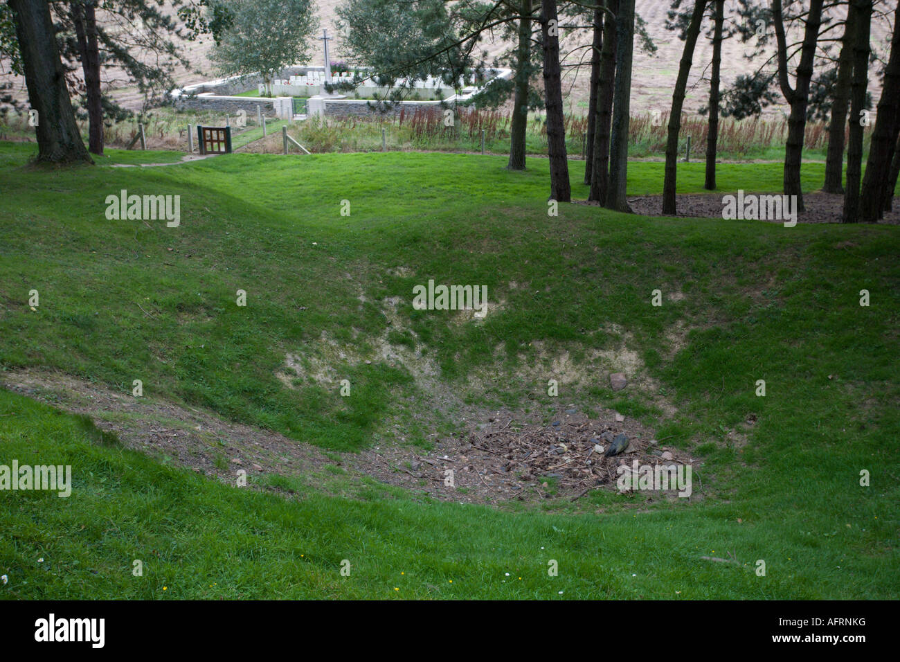 A shell crater at Sheffield Memorial Park with Railway Hollow Cemetery ...