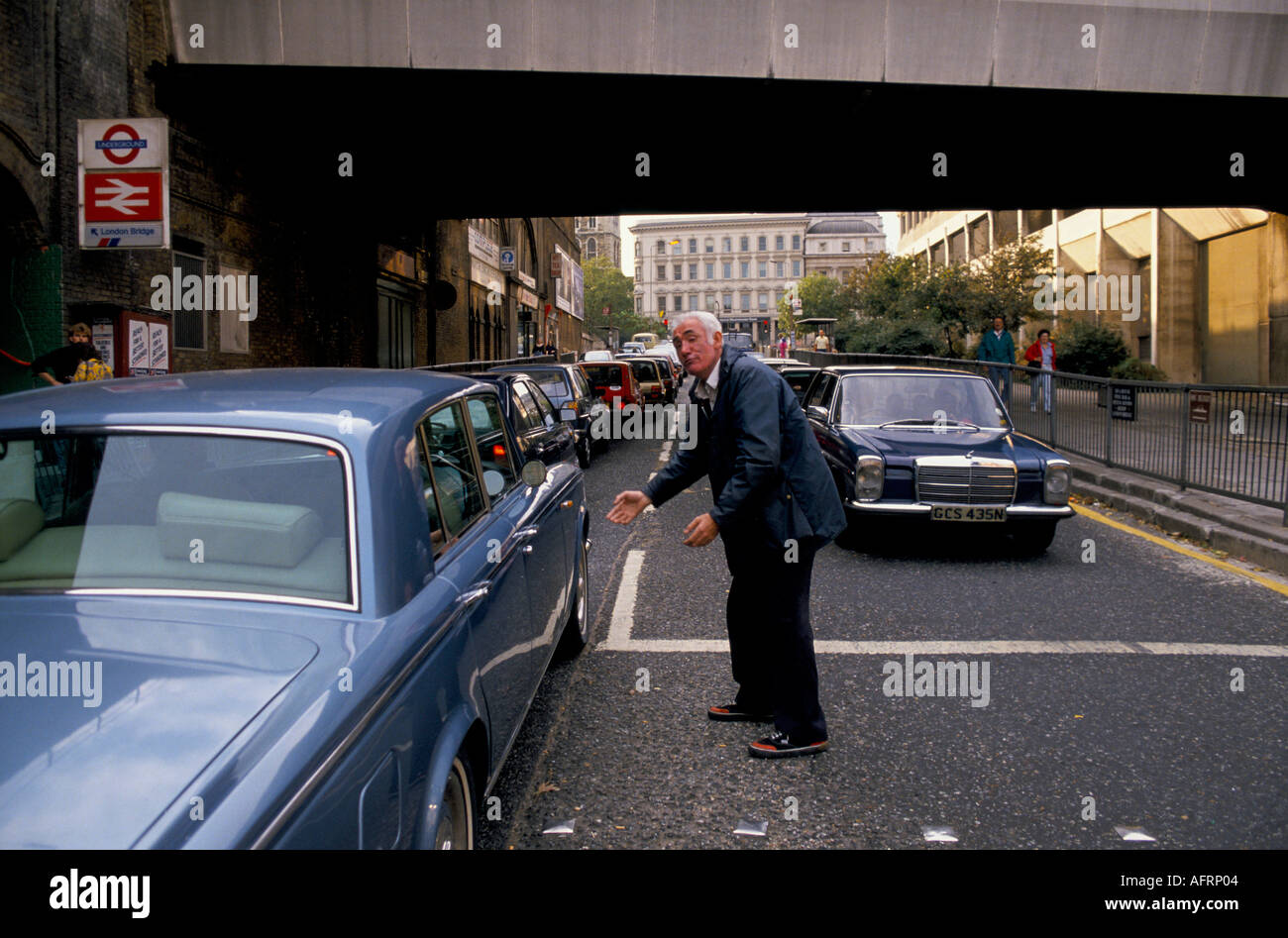 Rich poor social contrast UK City of London Homeless tramp begs begging ...