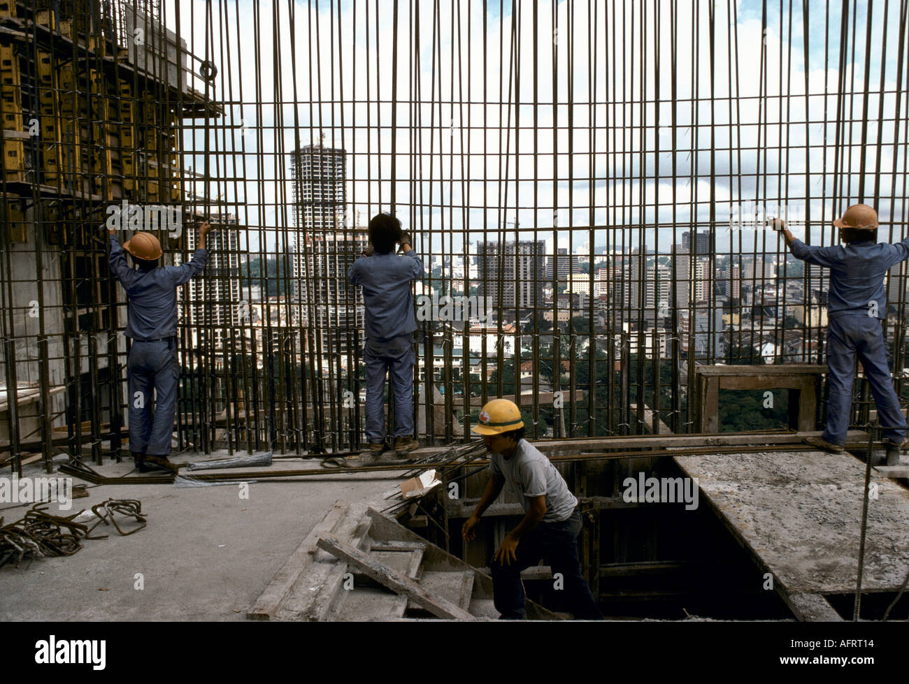 Singapore building site on reclaimed land. Construction workers. Circa ...