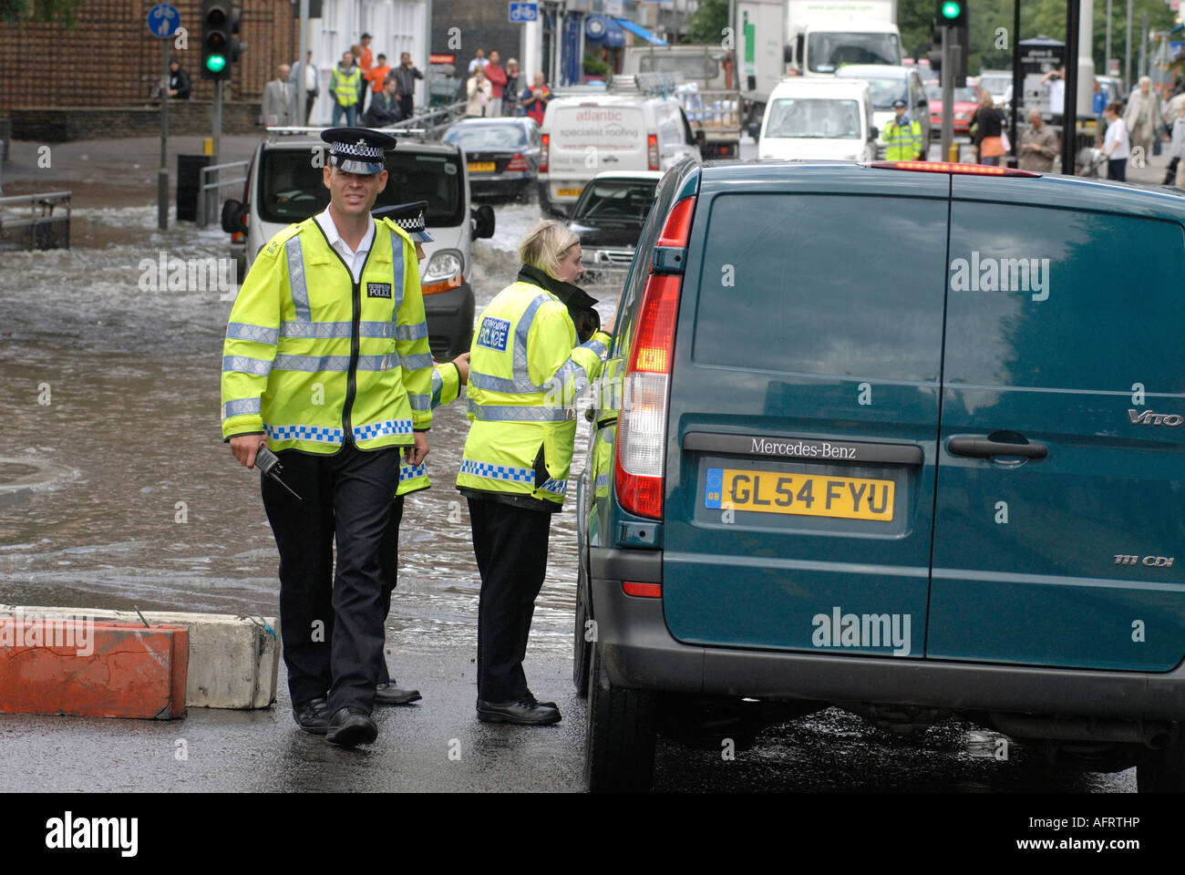 Police Officers in attendance shortly after torrential rain and flash ...