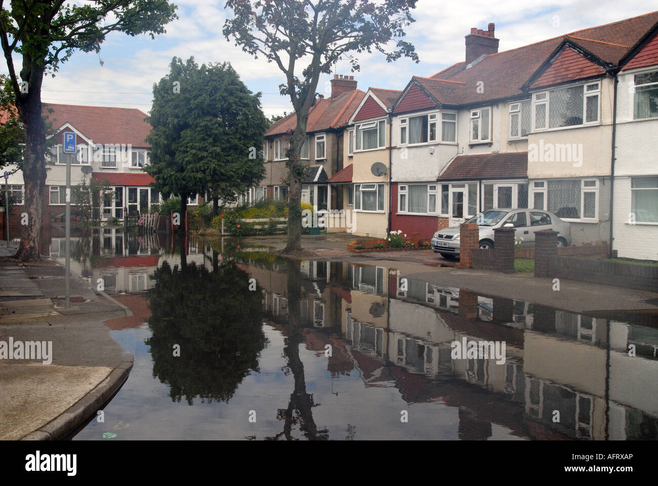 A flooded Suburban Road shortly after torrential rain and flash ...