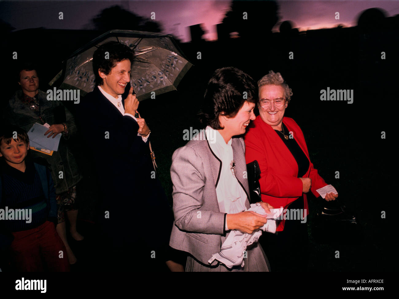 Group of people at night hi-res stock photography and images - Alamy