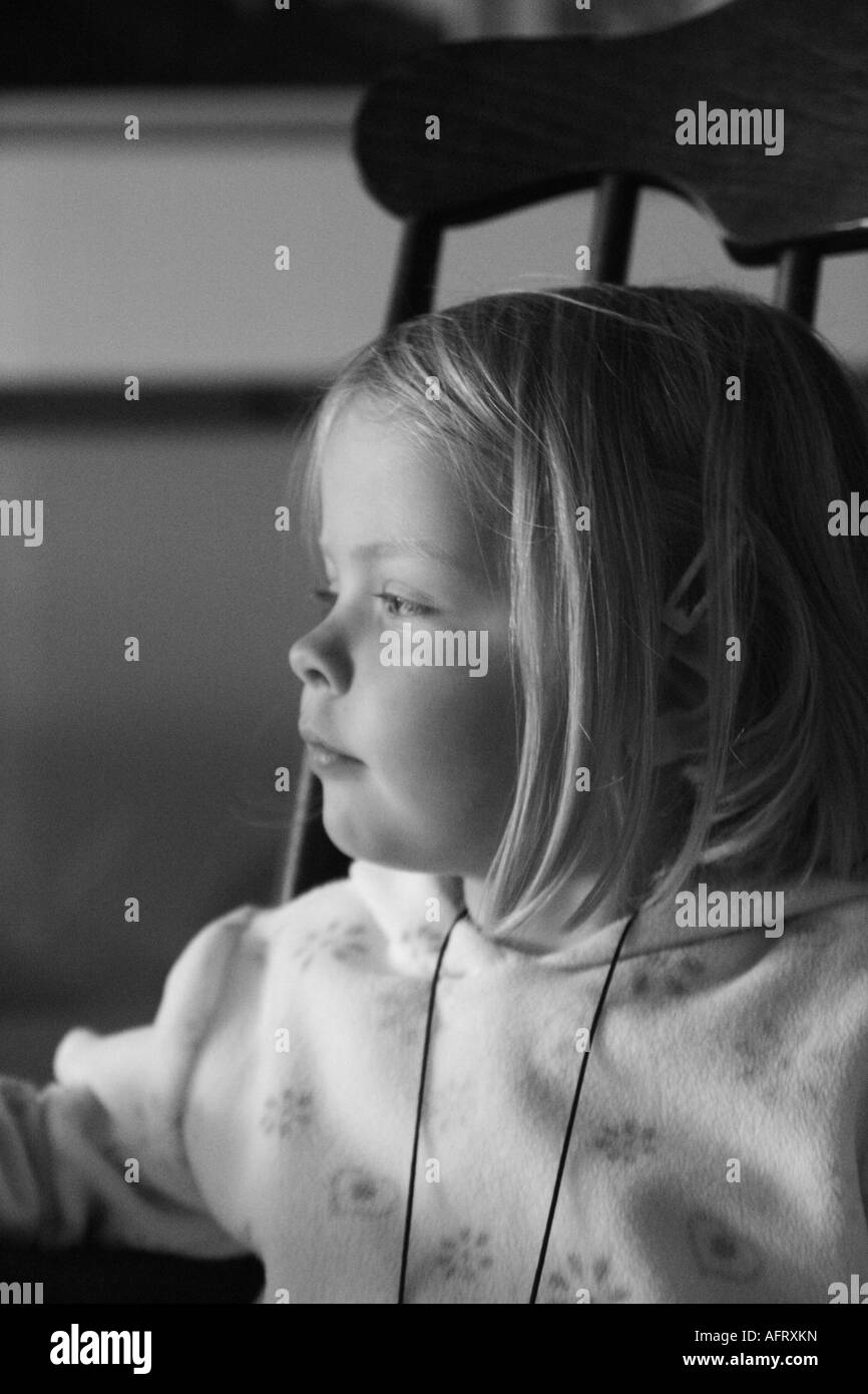 Girl thinking rocking chair hi-res stock photography and images - Alamy