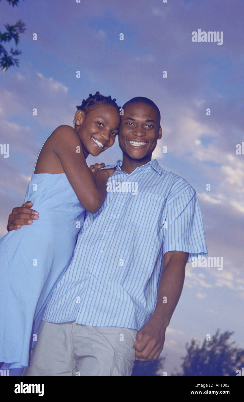 Black couple hugging Stock Photo - Alamy