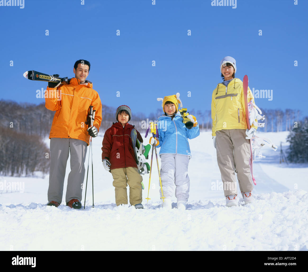 Family in Snow Stock Photo - Alamy