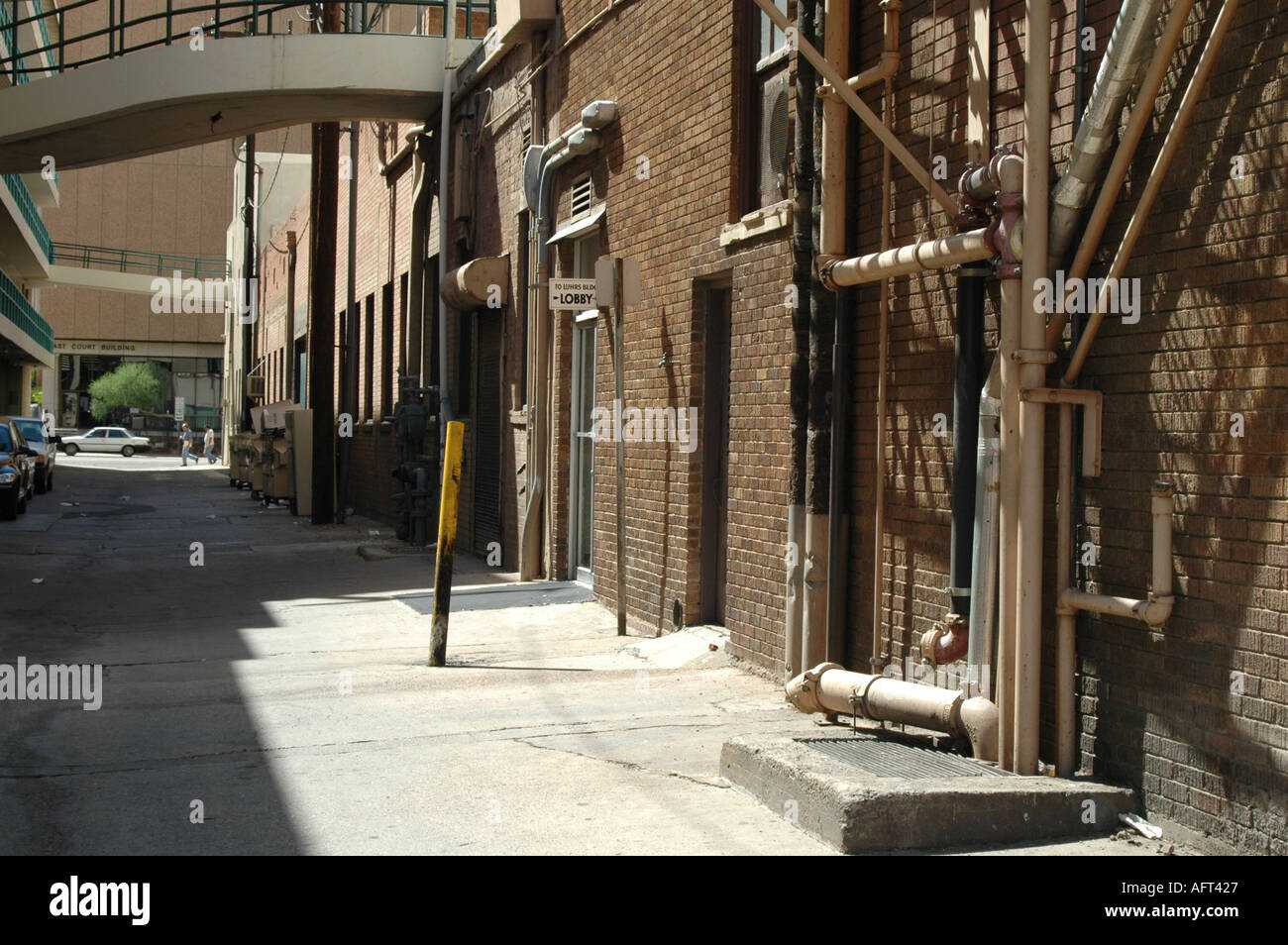 Alley behind building in urban environment Stock Photo - Alamy