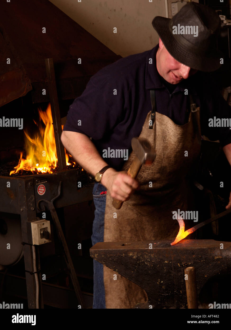 Blacksmith hammering hot iron High Resolution Stock Photography and ...