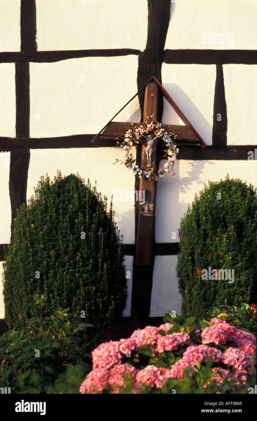 Netherlands Mechelen Catholic cross by wall of frame house Stock Photo ...