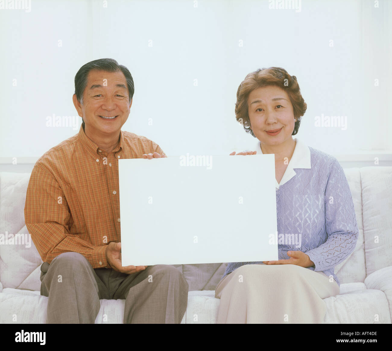 Elderly Couple Message Board Stock Photo - Alamy
