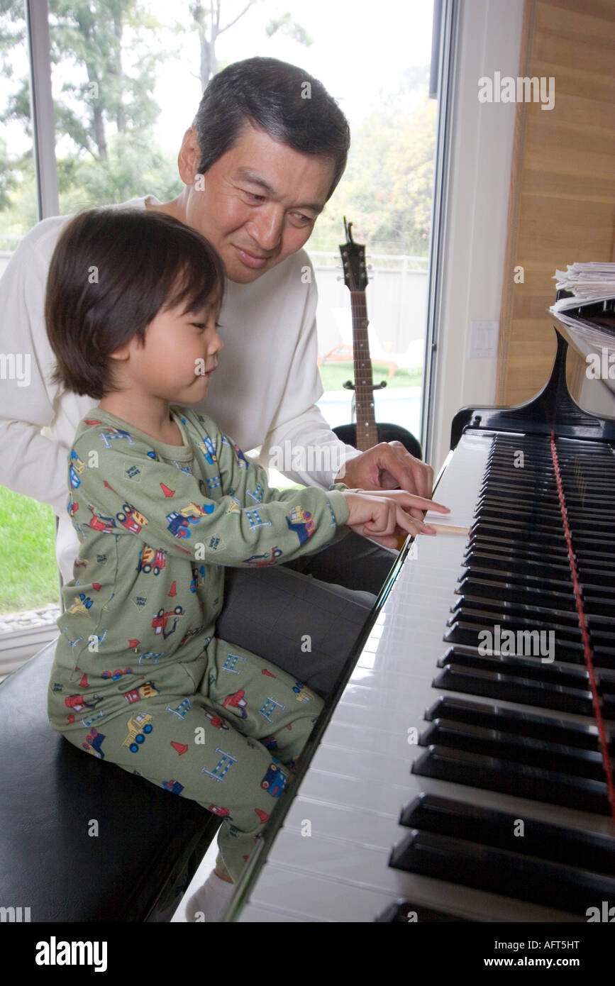Young Boy Taking Piano Lesson Stock Photo - Alamy
